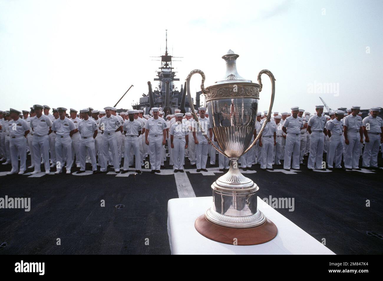 The crew of the battleship USS IOWA (BB 61) stand at parade rest during ...