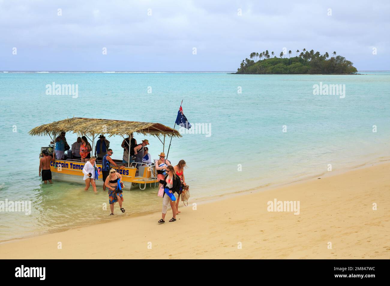 A "Captain Tama's Lagoon Cruizes" boat on the beach at Muri on the ...