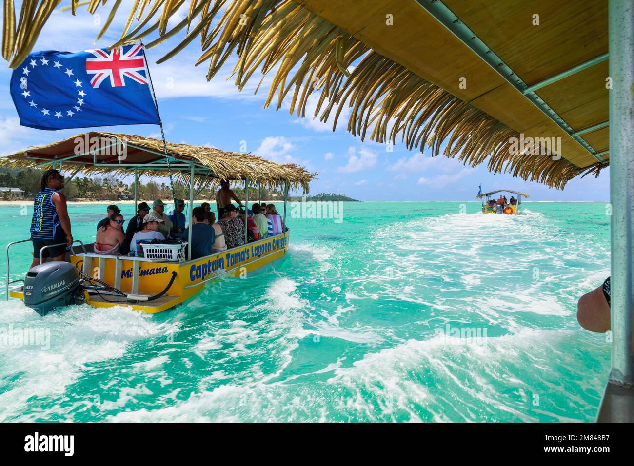 Tour boats on Muri Lagoon on the tropical island of Rarotonga, Cook ...