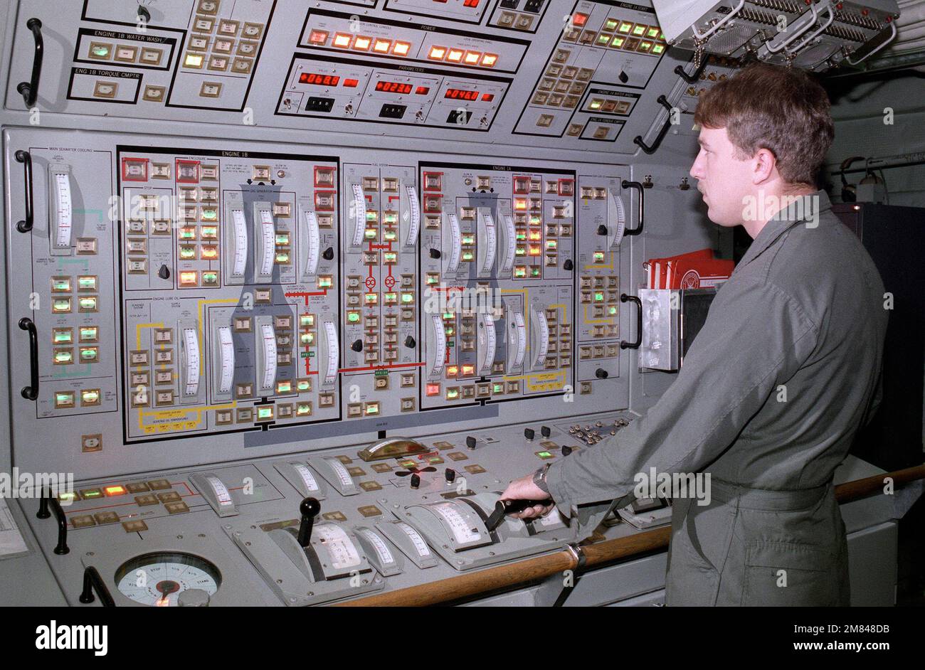 A crew member aboard the guided missile frigate USS HALYBURTON (FFG-40 ...