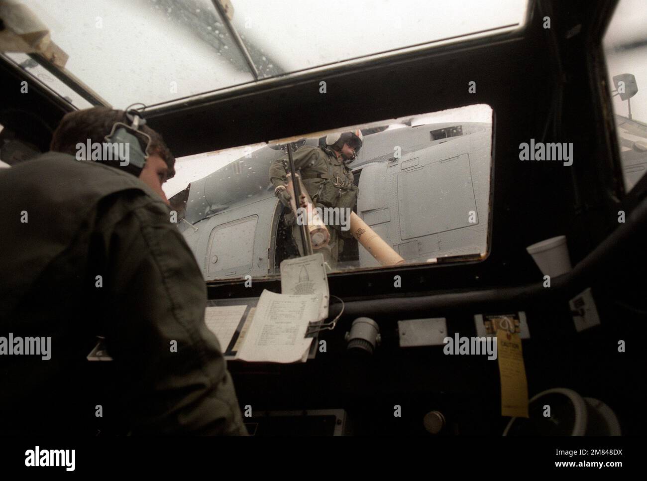 A crew member observes from the recovery assist secure and traversing ...
