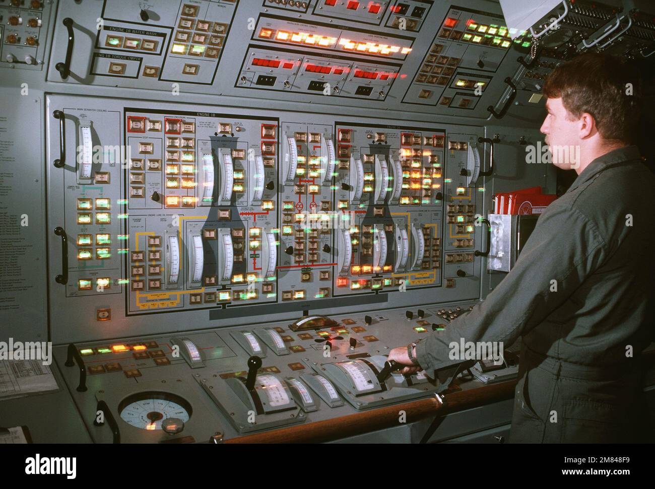 A crew member aboard the guided missile frigate USS HALYBURTON (FFG 40 ...