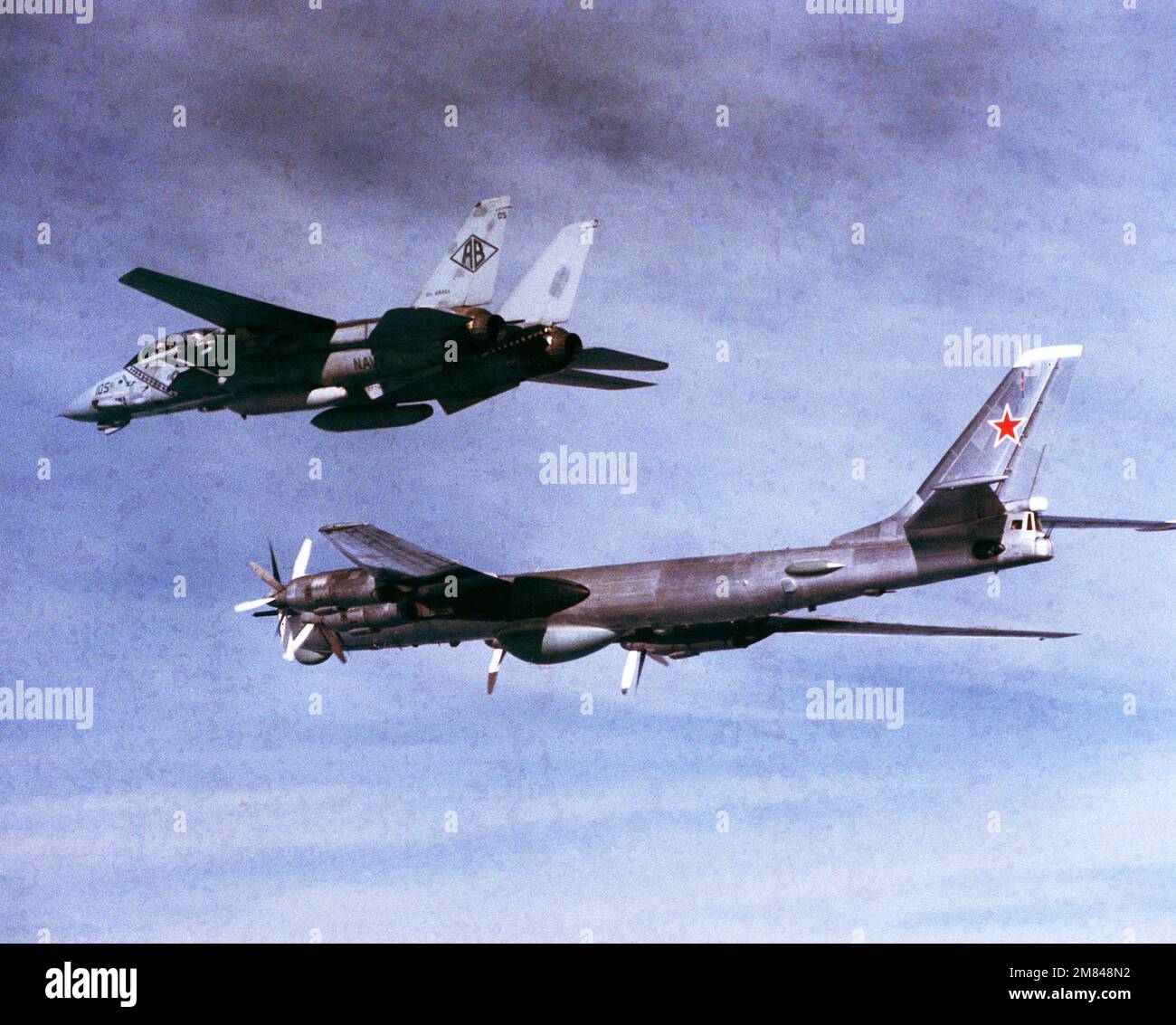 An air-to-air left underside view of an F-14A Tomcat aircraft from ...