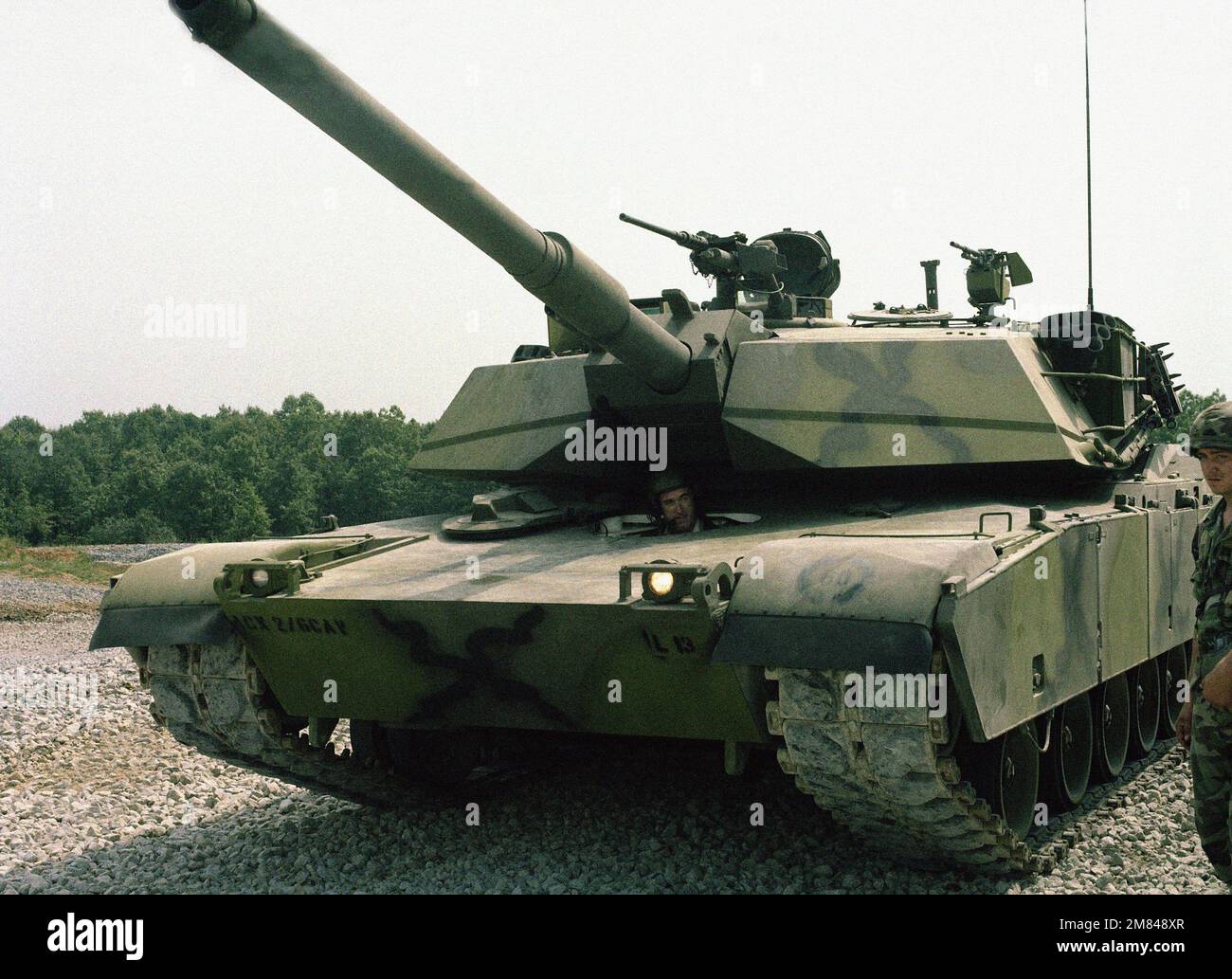 Major General Cooper of the British Royal Armoured Corps sits in the ...