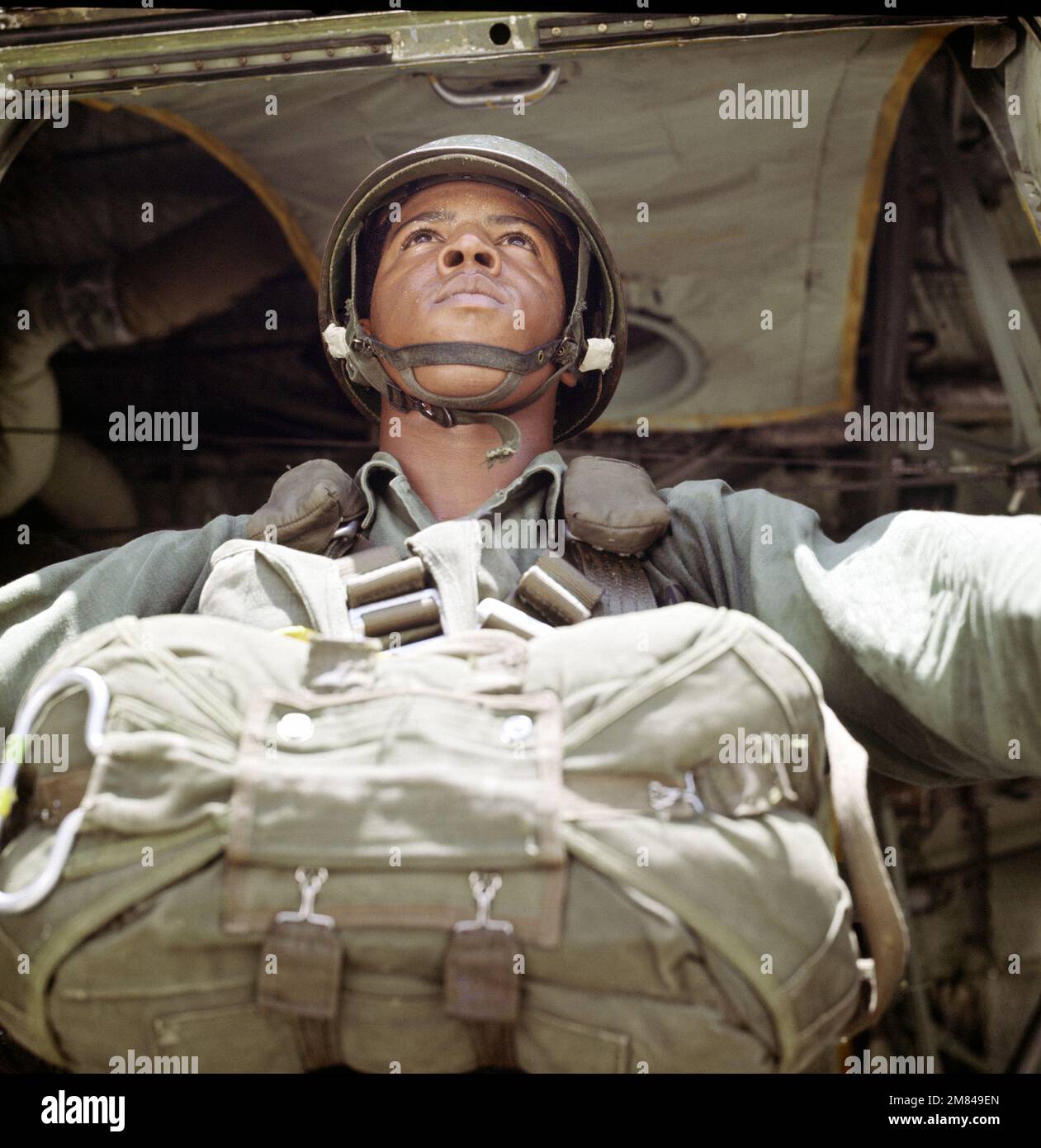 A U.S. Army Ranger prepares to parachute from an aircraft. Country ...