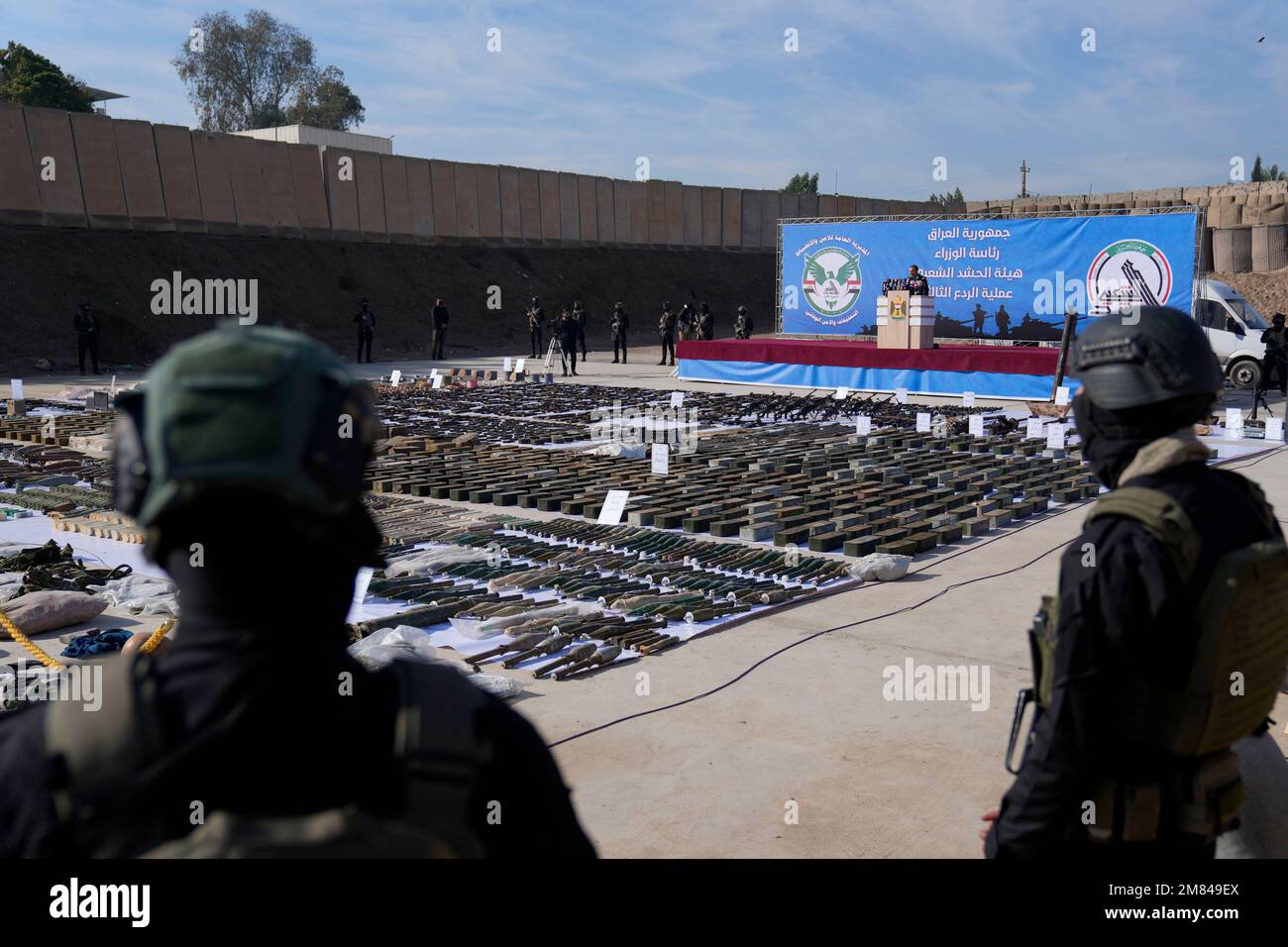 The Popular Mobilization Forces (PMF) display weapons seized from ISIS ...