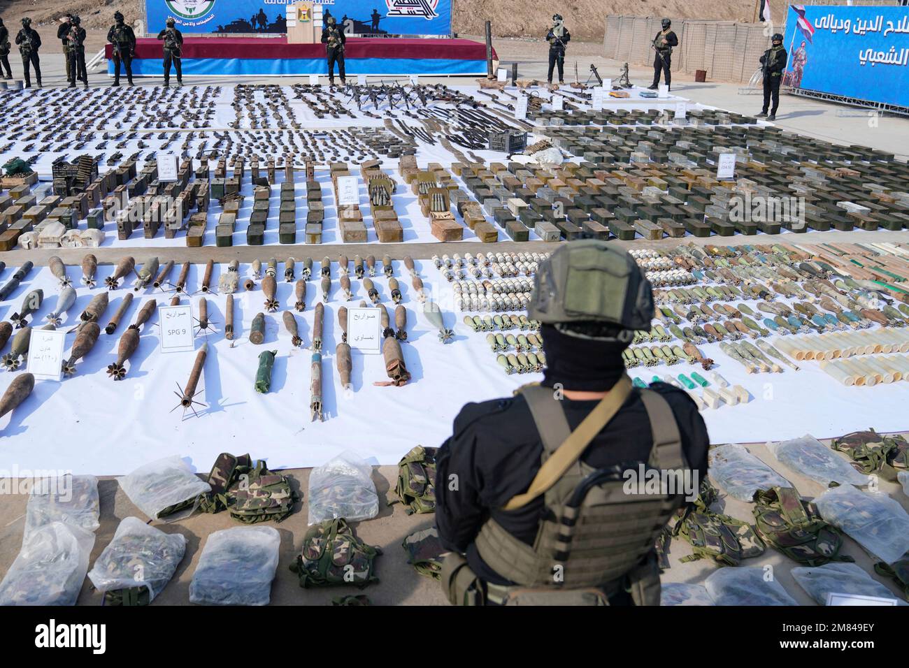 The Popular Mobilization Forces (PMF) display weapons seized from ISIS ...