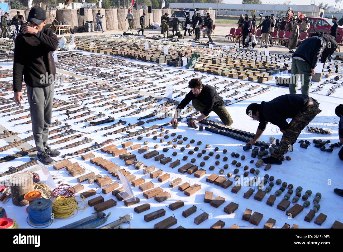 The Popular Mobilization Forces (PMF) display weapons seized from ISIS ...