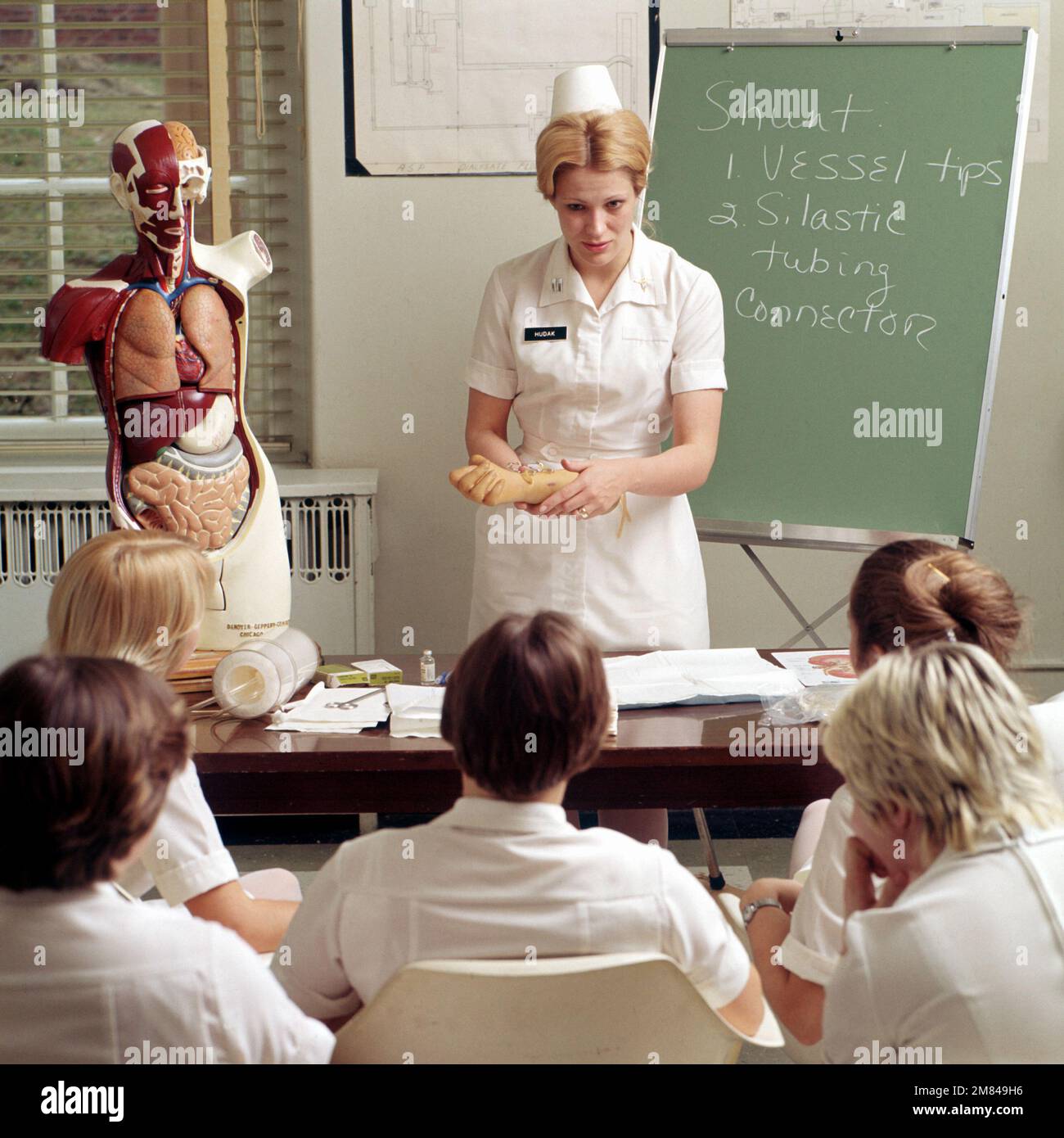 A U.S. Army nurse explains shunt procedures to students. Country ...