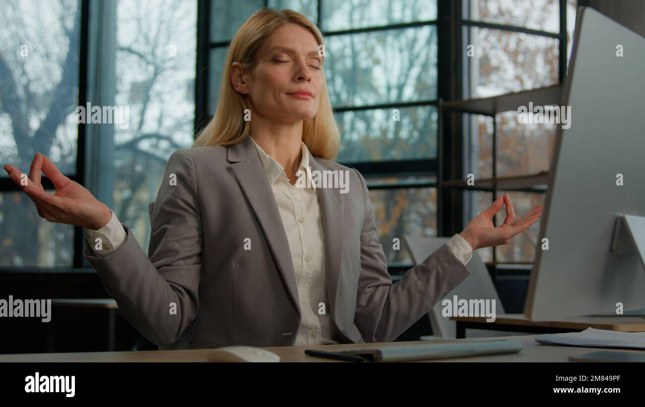 Calm Caucasian middle-aged adult woman mindfulness mature business ...