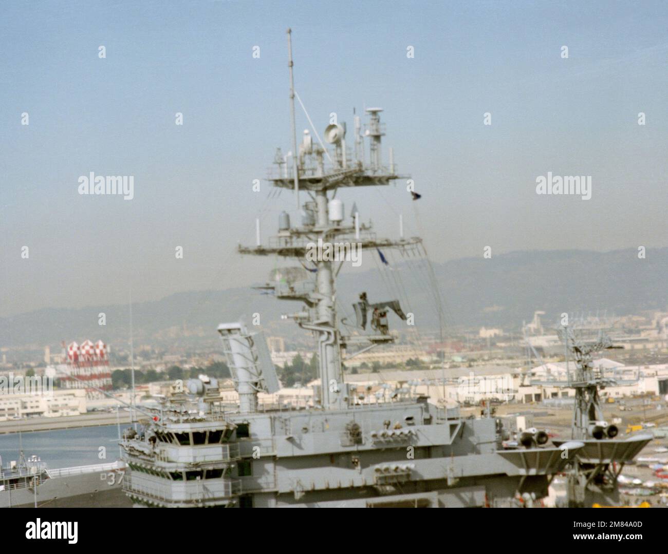 A view of various antennas mounted on the mast and island of the ...
