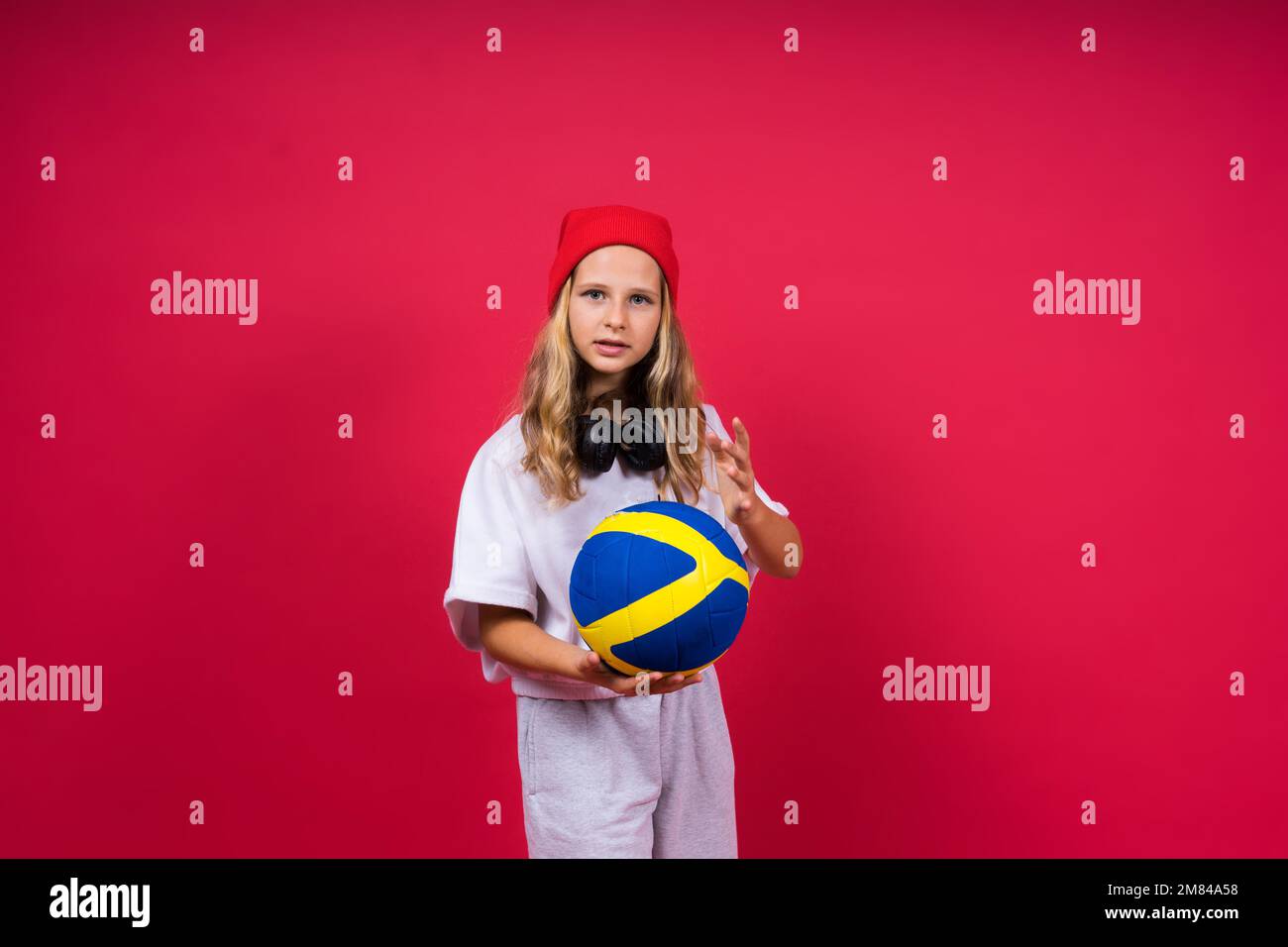 Portrait Of A Cute Eight Year Old Girl In Volleyball Outfit Isolated On