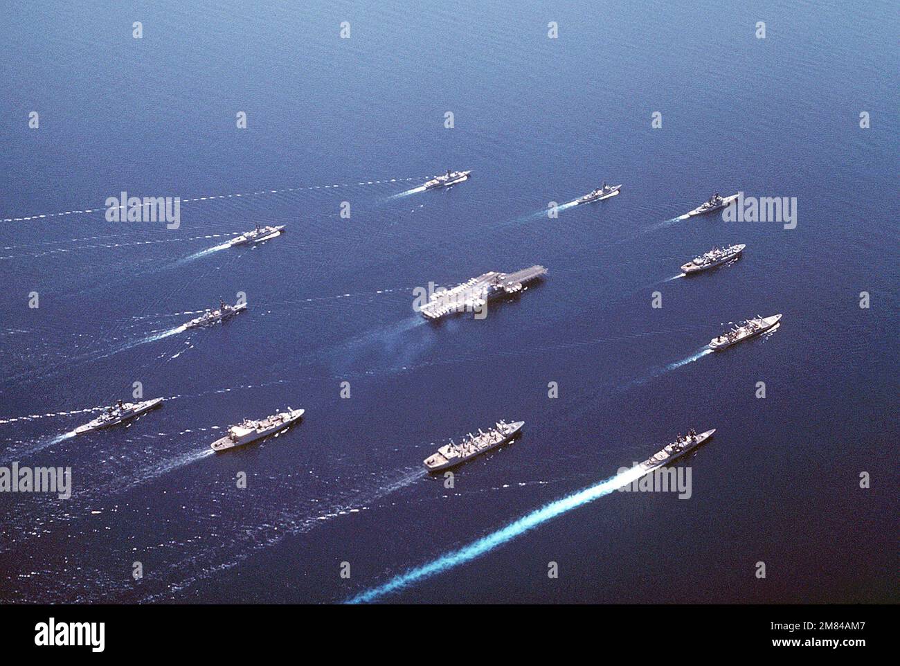 An aerial starboard quarter view of Battle Group Alfa underway. The ...