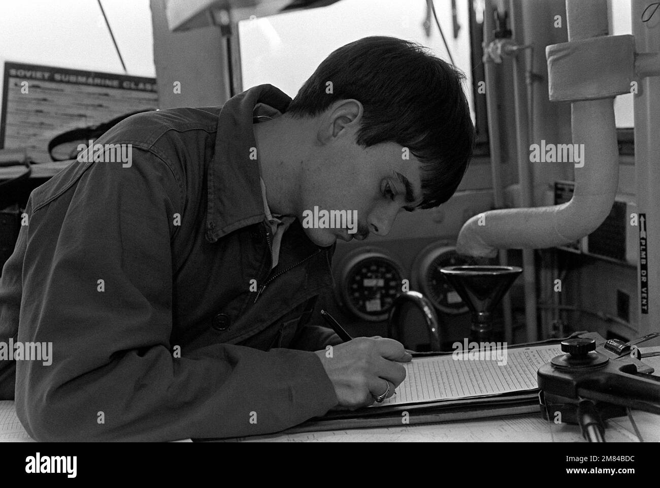 The quartermaster aboard the USS HALYBURTON (FFG-40) plots a course ...