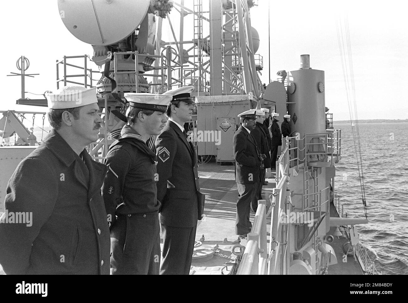 United States and German sailors man the rail aboard the guided missile ...