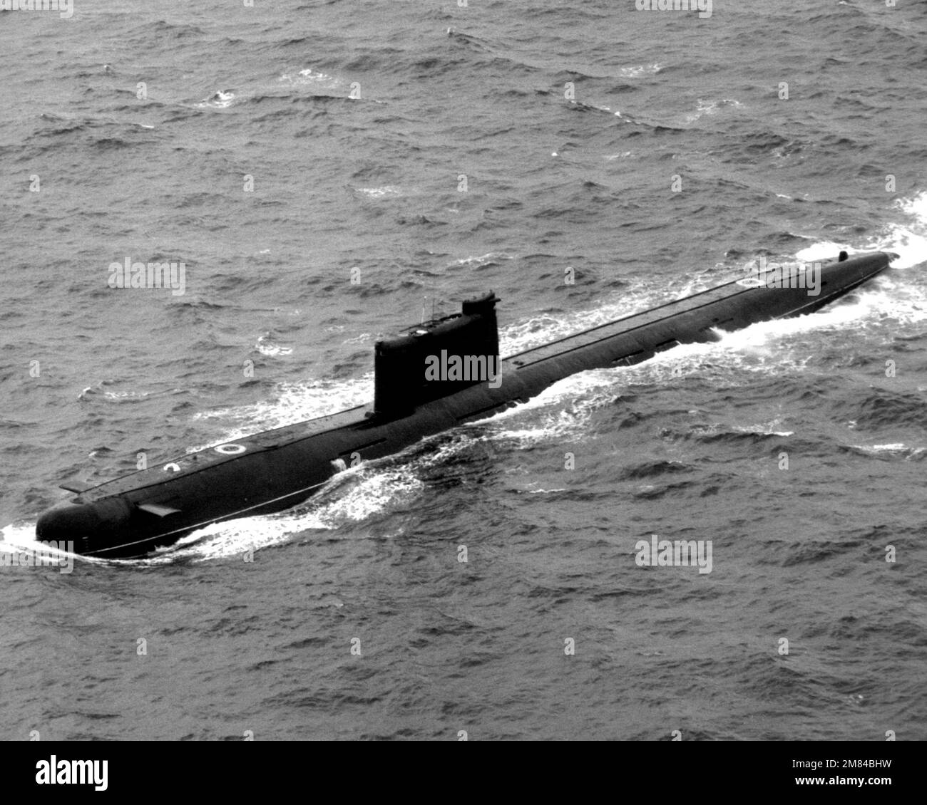An aerial port bow view of a Soviet Tango class attack submarine ...