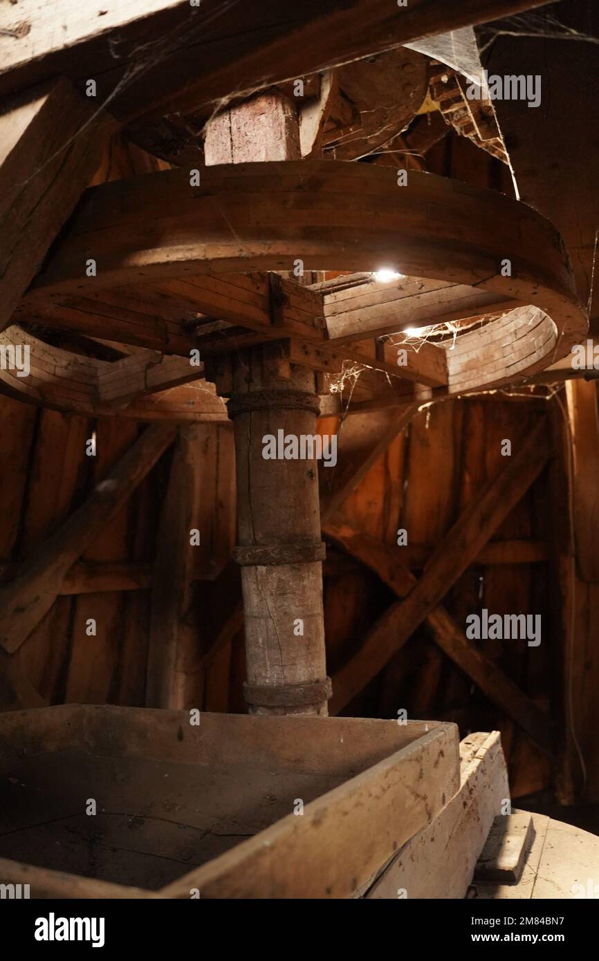Huge wooden antique mill mechanism from the inside Stock Photo - Alamy