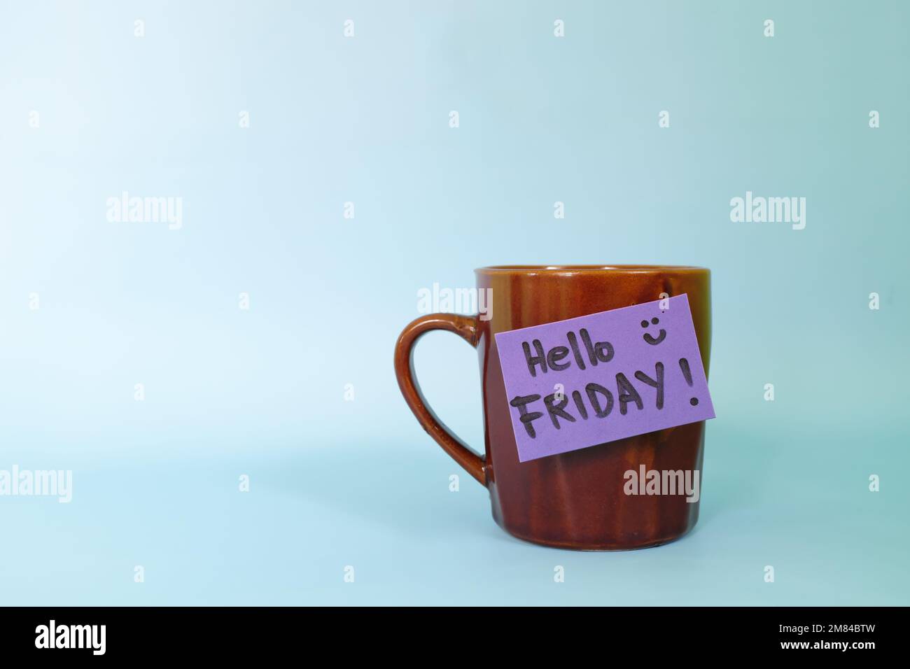 Welcome, hello and happy Friday concept. Selective focus of coffee cup ...