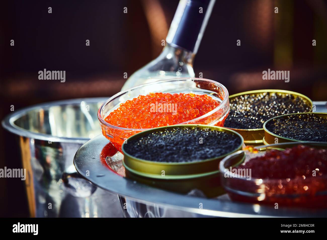 Covered and served furshet table, outdoor. Red and black caviar and ...