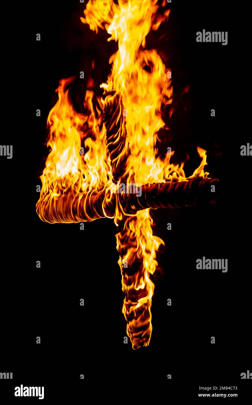 A burning cross at Lewes bonfire night representing one of the ...