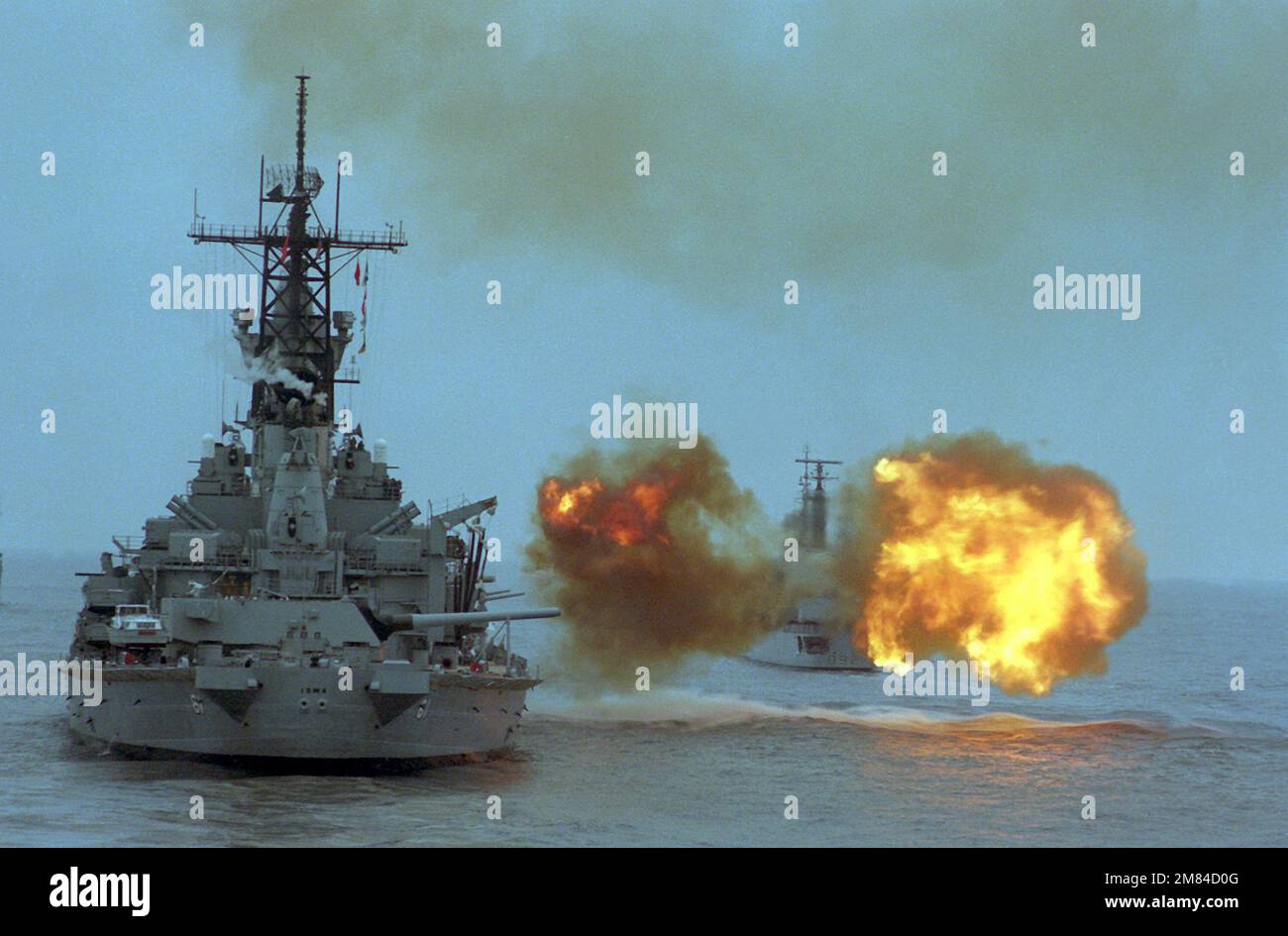 A stern view of the battleship USS IOWA (BB-61) conducting a gunnery ...