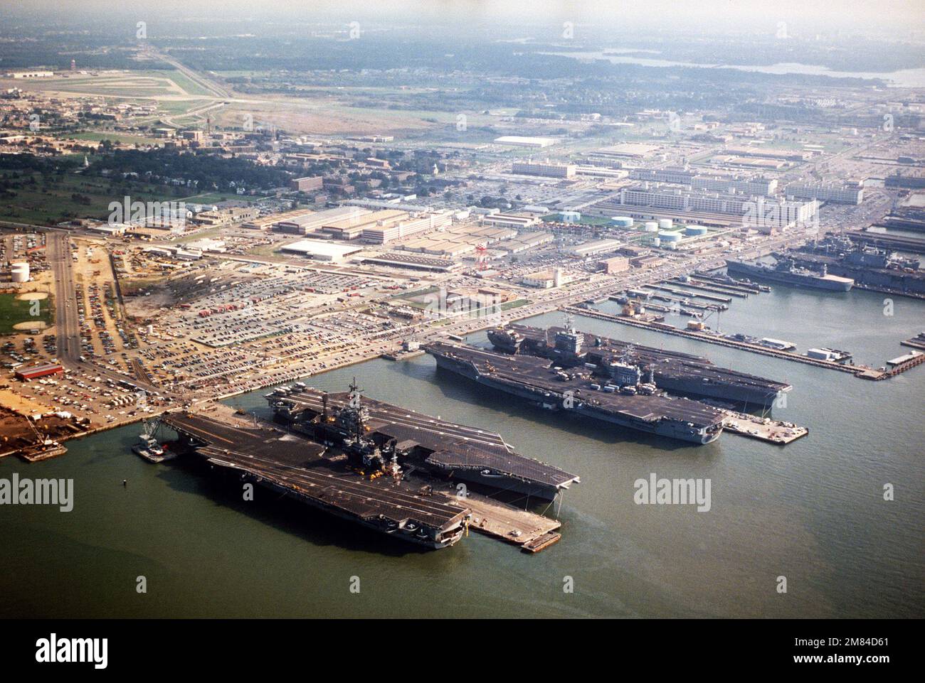 An elevated view (left to right) of the aircraft carriers USS AMERICA ...