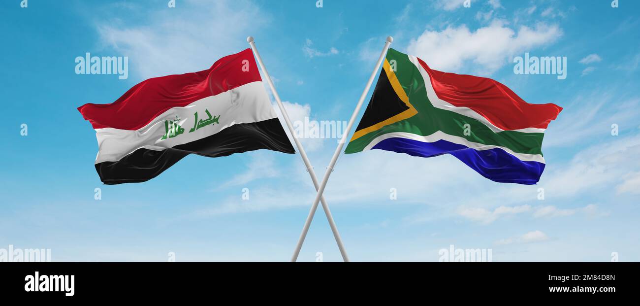 two crossed flags South Africa and Iraq waving in wind at cloudy sky ...