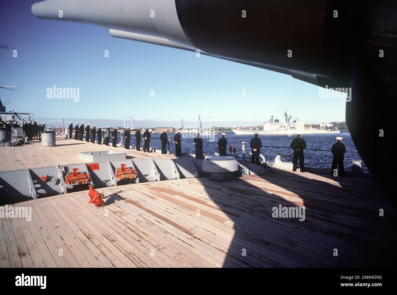 Crewman aboard the battleship USS IOWA (BB-61) man the rails during the ...