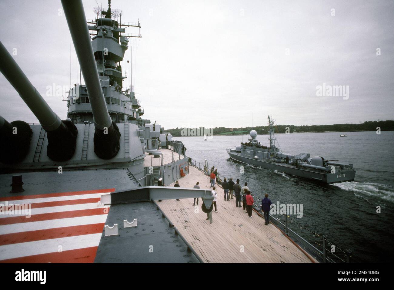 Visitors watch from the USS IOWA (BB-61) watch as the Type 143 fast ...