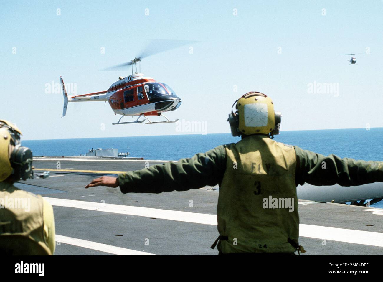 A TH-57 Sea Ranger helicopter lands on the deck of the training ...