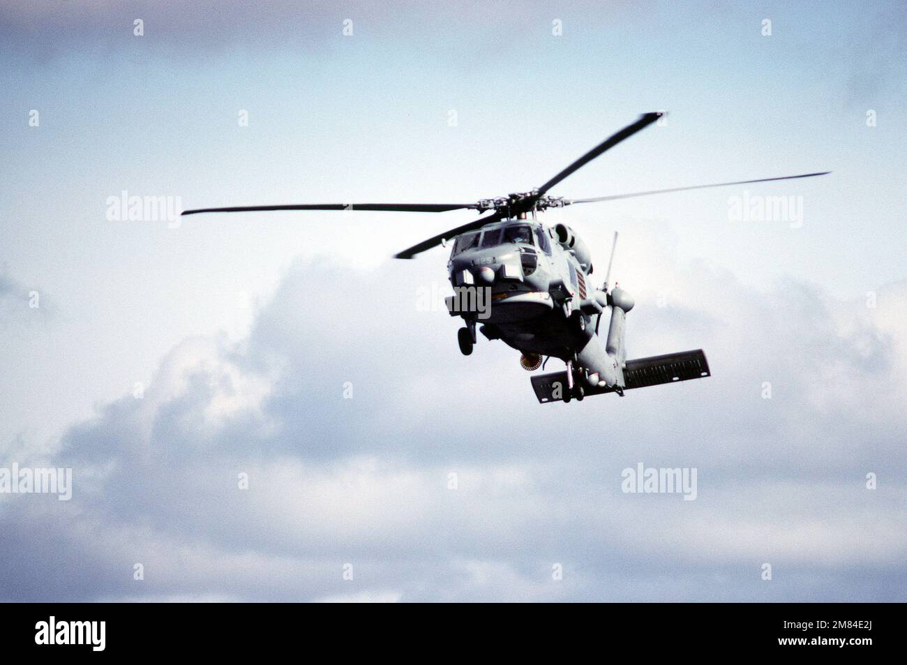 A SH-60B Seahawk helicopter approaches for a landing on the stern of a ...