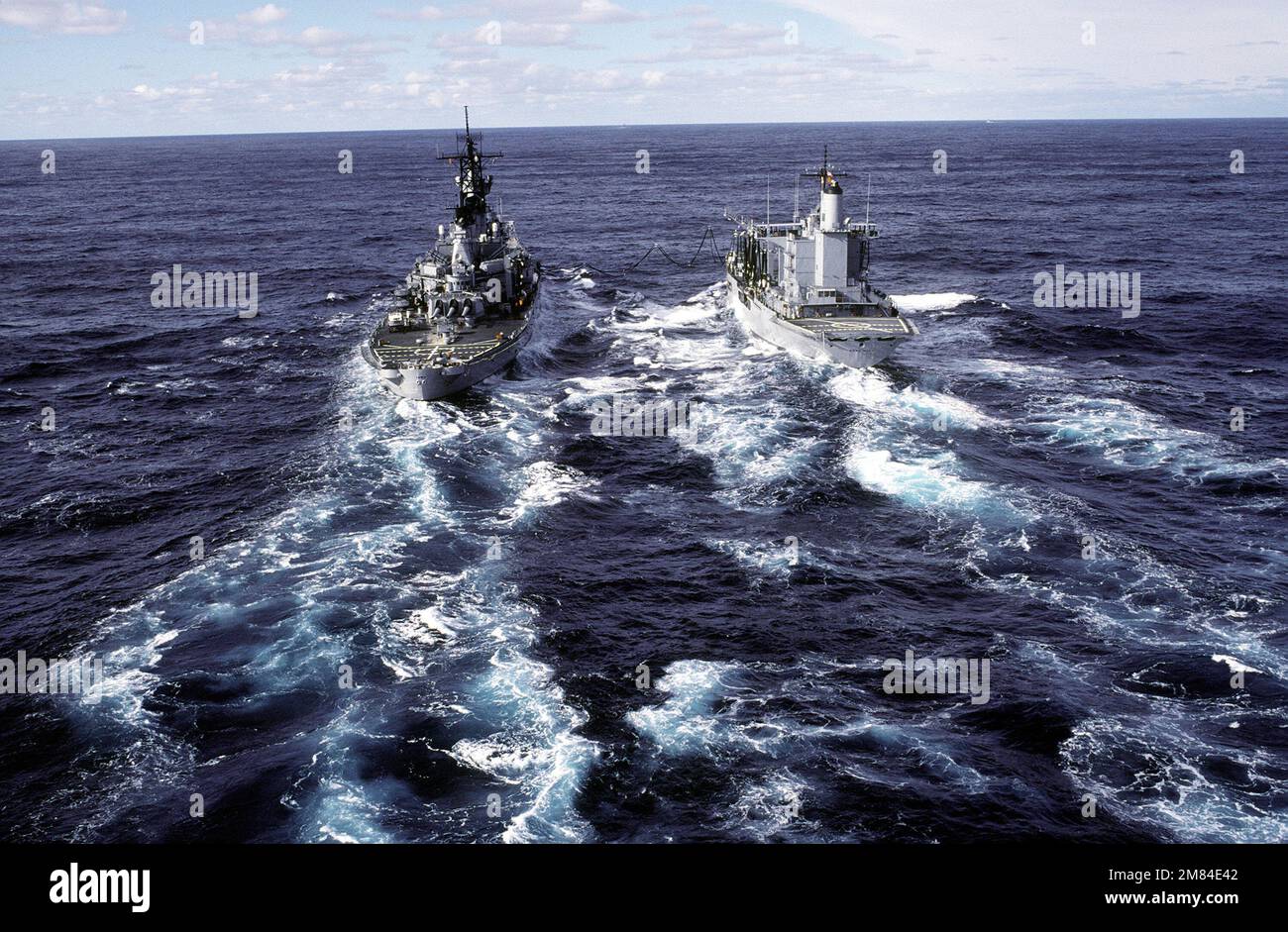 An stern view of the fleet oiler USS MERRIMACK (AO-179) refueling the ...