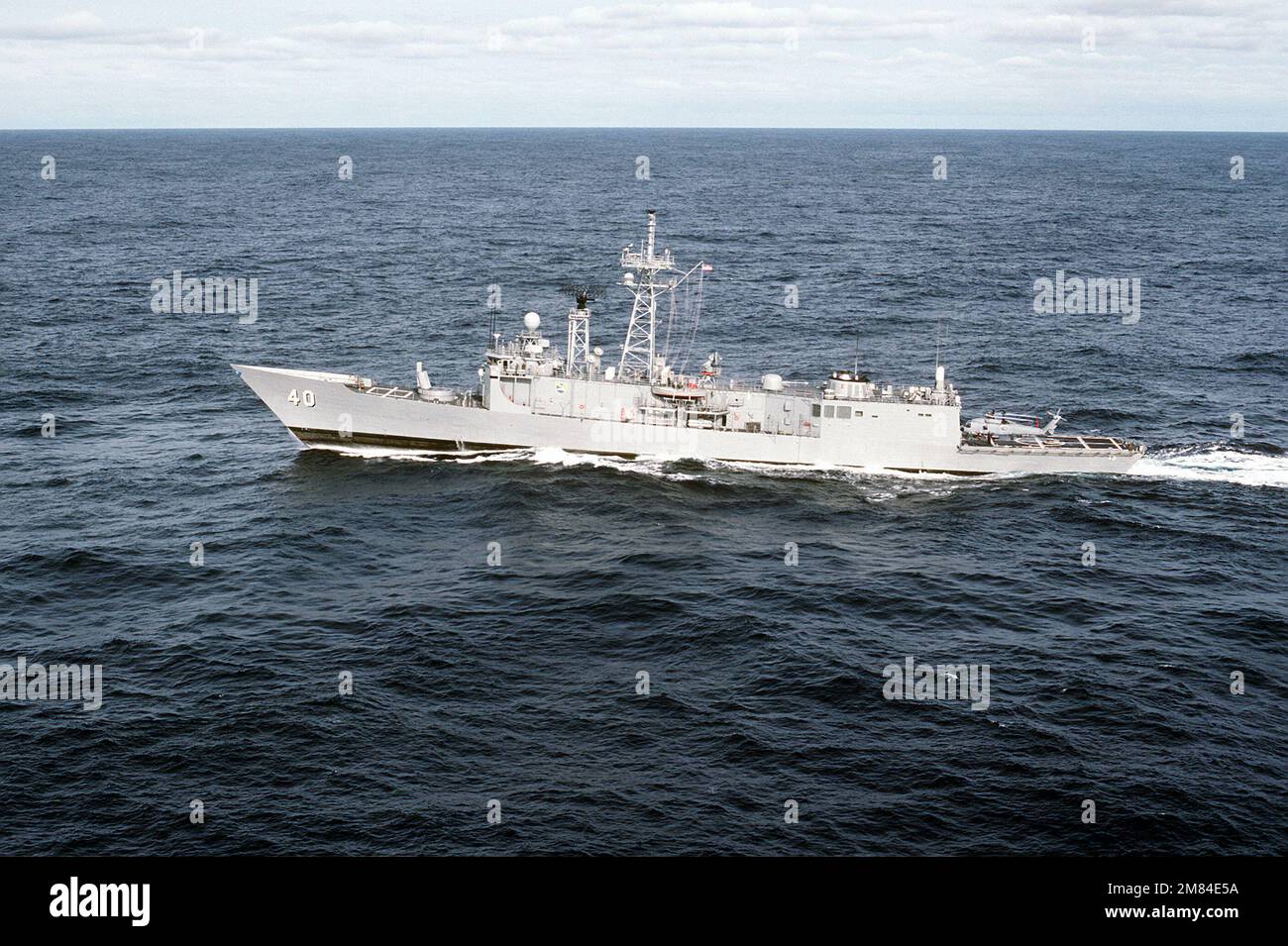 An elevated port beam view of the guided missile frigate USS HALYBURTON ...