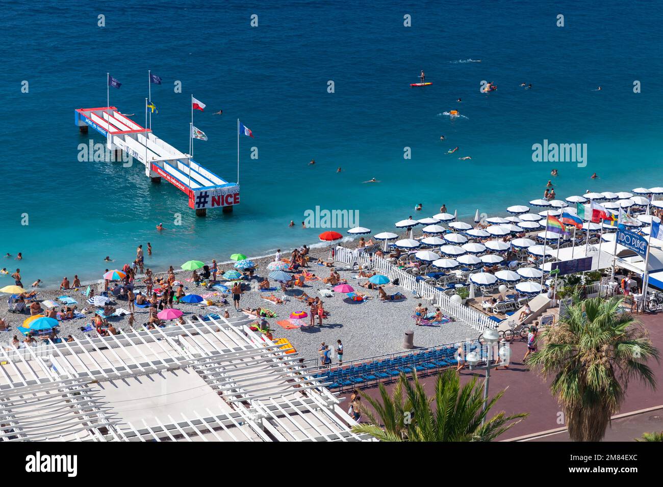 Nice, France - August 12, 2018: Public beach in Nice with relaxing ...