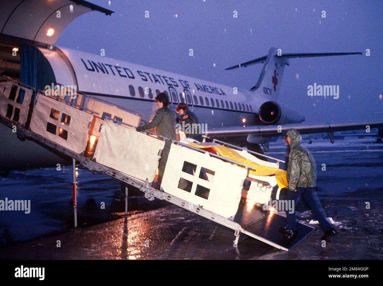 Jackie Pfluge, 30, of Pasadena, Texas, is carried by Air Force ...
