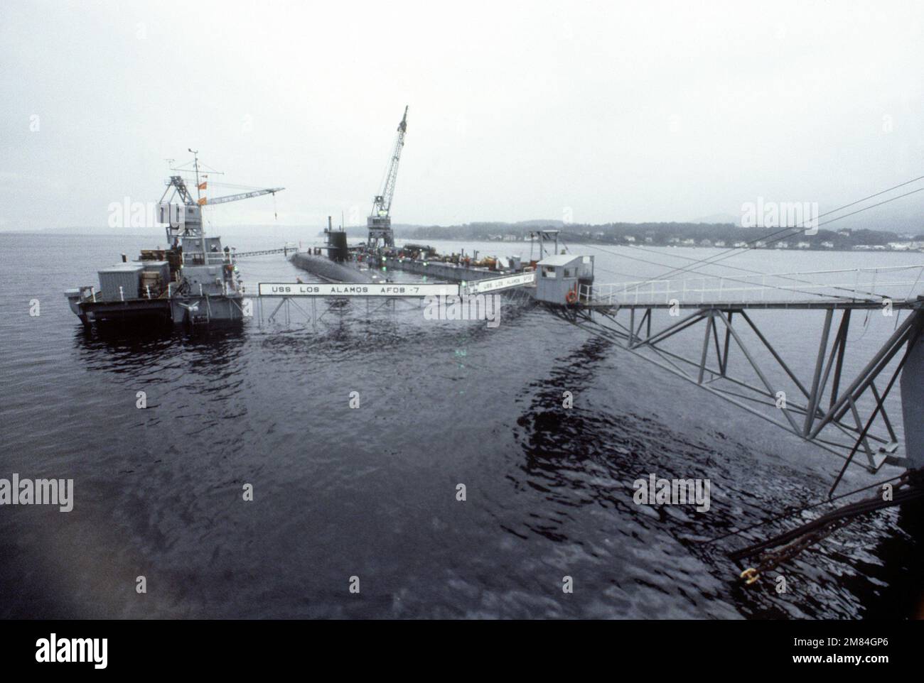 A submarine rest inside the large auxiliary floating dry dock USS Los ...