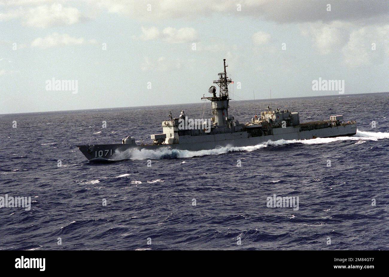 A port bow view of the frigate USS BADGER (FF-1071) underway. Country ...