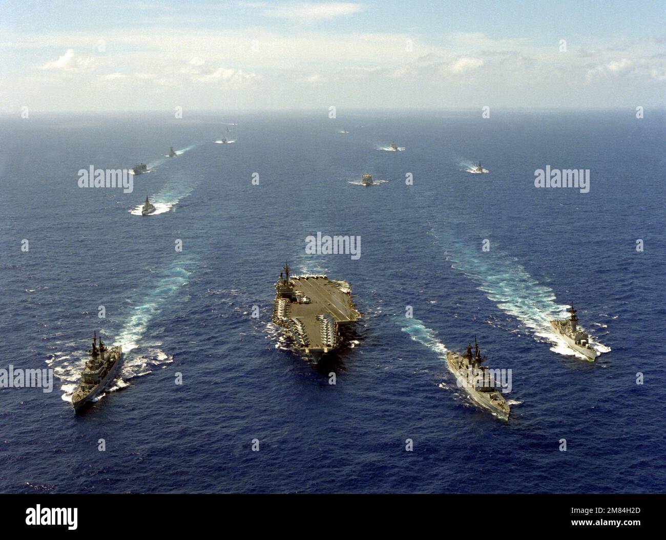 An aerial bow view of the aircraft carrier USS KITTY HAWK (CV-63) and ...