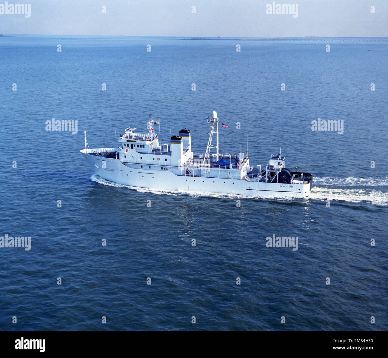 An elevated port bow view of the ocean surveillance ship USNS ...