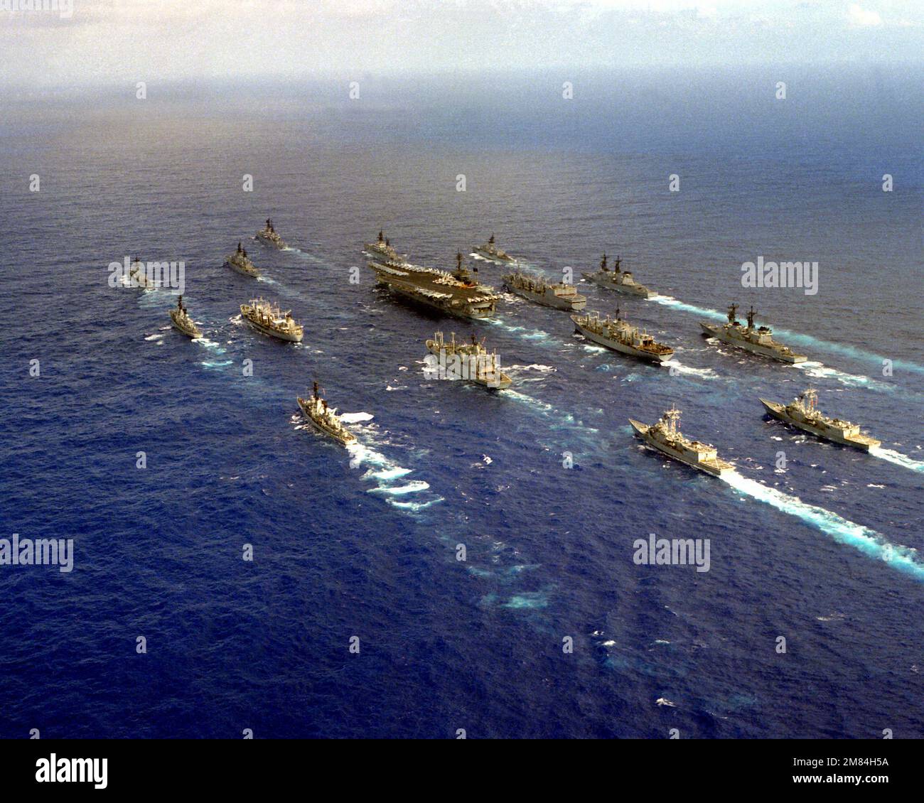 An aerial view of the aircraft carrier USS KITTY HAWK (CV-63) and other ...