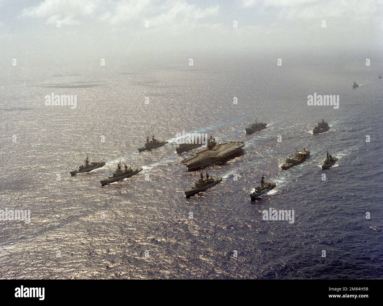An aerial view of the aircraft carrier USS KITTY HAWK (CV-63) and other ...