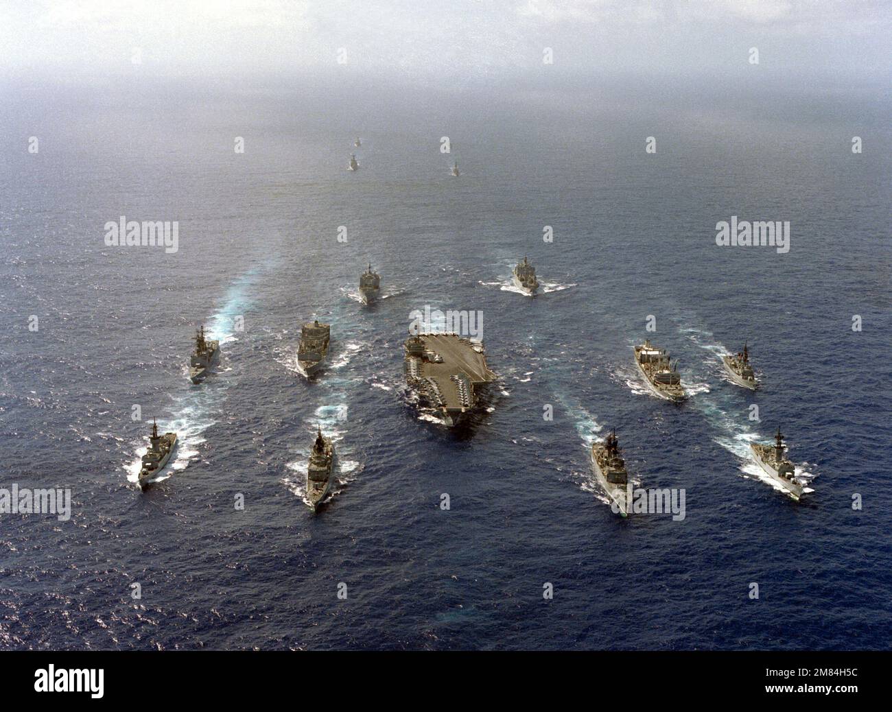 An aerial view of the aircraft carrier USS KITTY HAWK (CV-63) and other ...