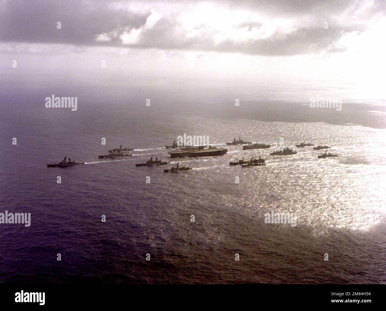 An aerial view of the aircraft carrier USS KITTY HAWK (CV-63) and other ...