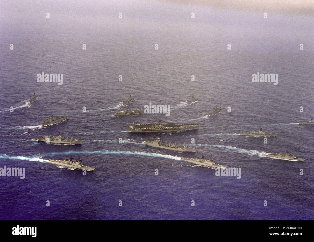A aerial view of the aircraft carrier USS KITTY HAWK (CV-63) and other ...