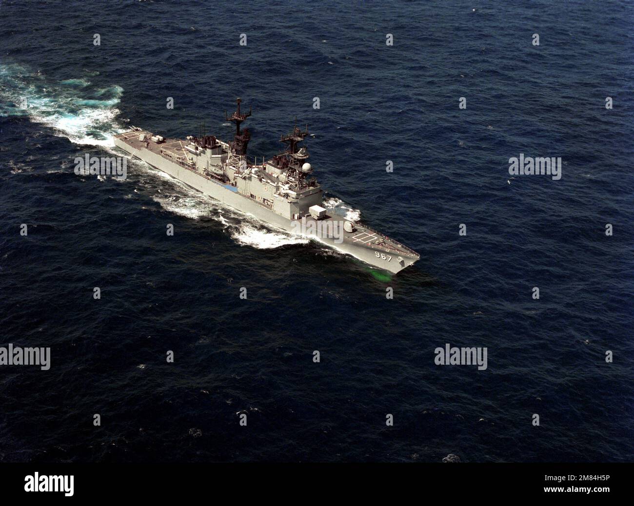 A aerial starboard view of the destroyer USS ELLIOTT (DD-967) underway ...