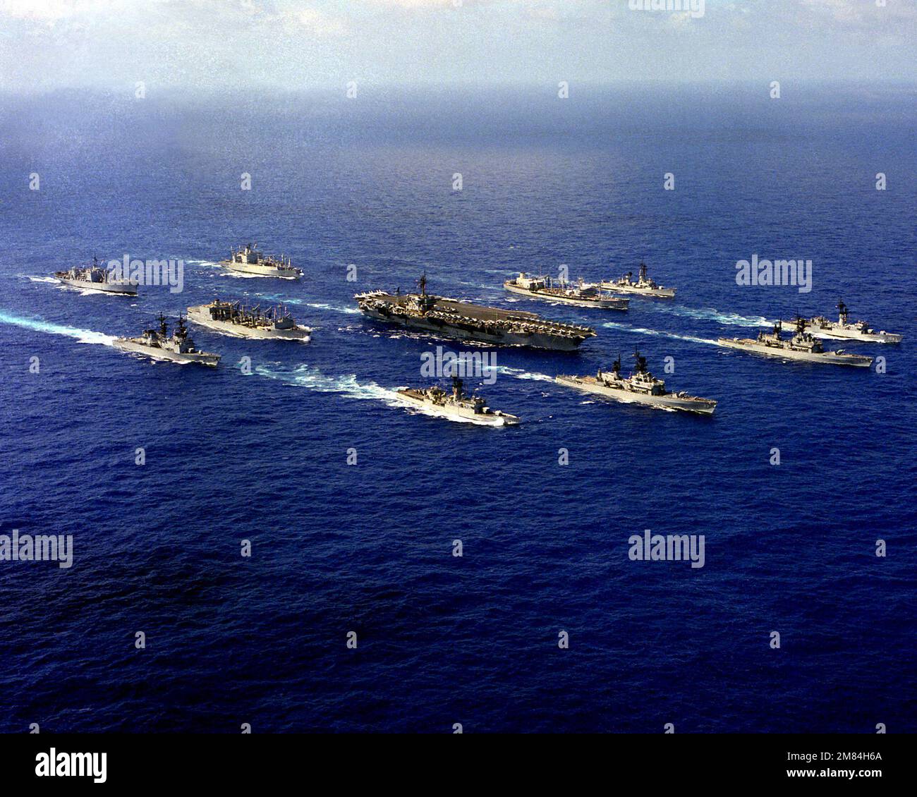 An aerial view of the aircraft carrier USS KITTY HAWK (CV-63) and other ...