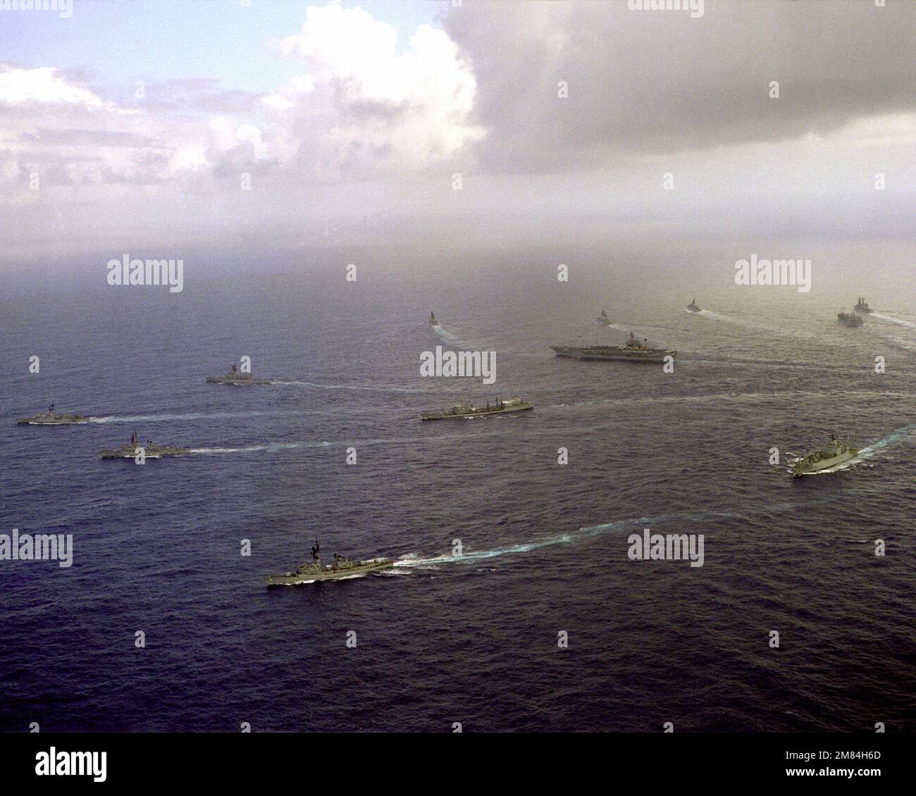 An aerial view of the aircraft carrier USS KITTY HAWK (CV-63) and other ...