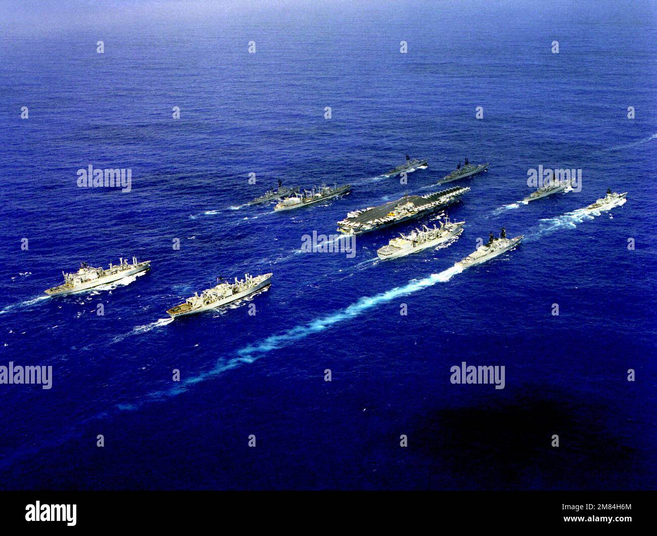 An aerial view of the aircraft carrier USS KITTY HAWK (CV-63) and other ...