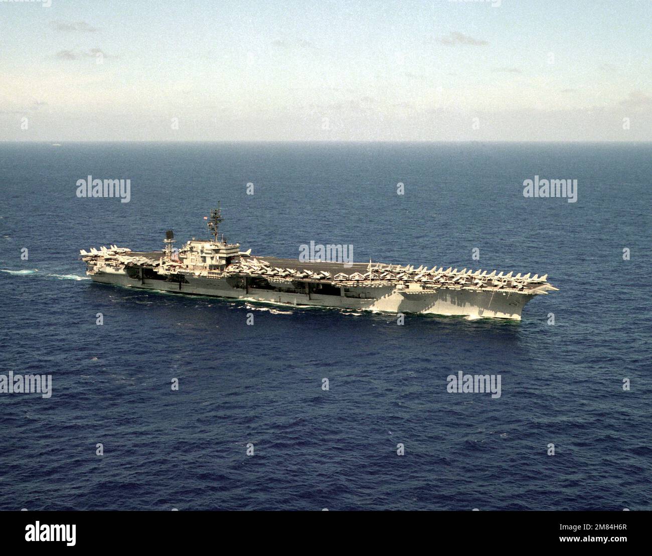 An aerial starboard view of the aircraft carrier USS KITTY HAWK (CV-63 ...