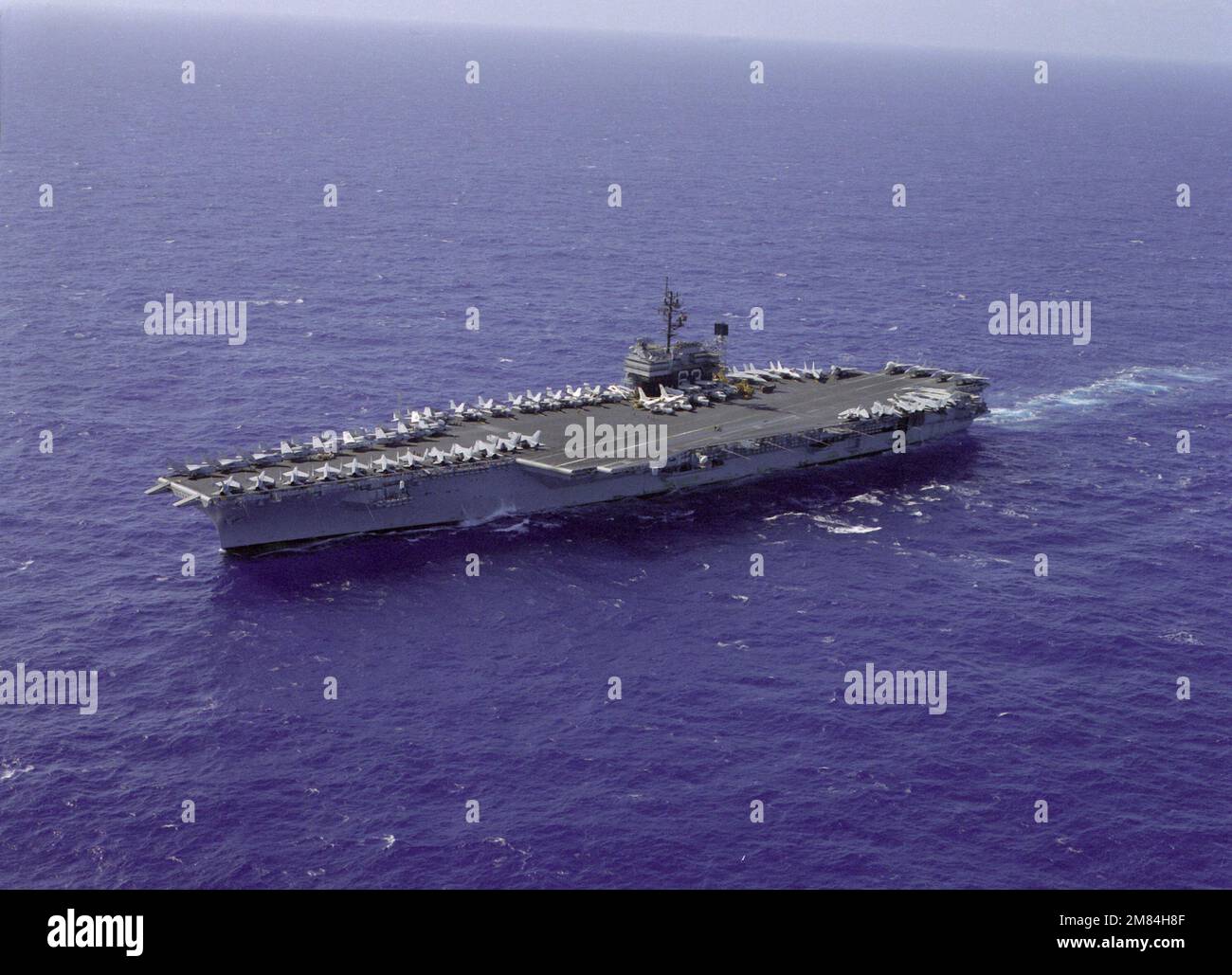 An aerial port bow view of the aircraft carrier USS KITTY HAWK (CV-63 ...